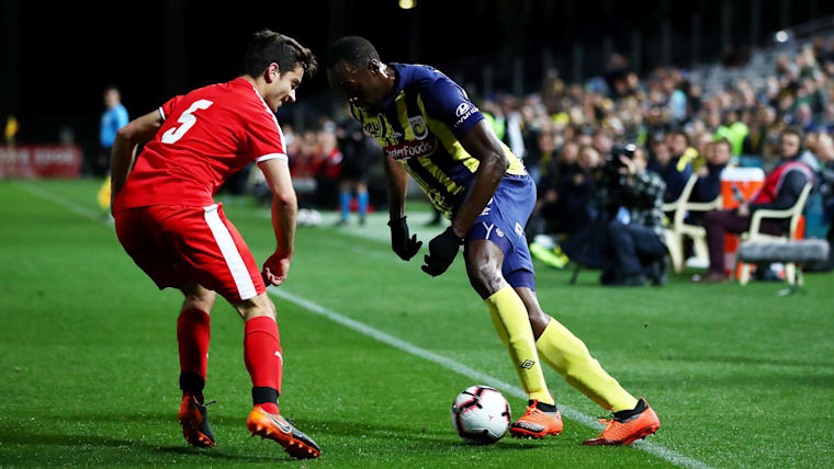 Bolt's football debut in pictures