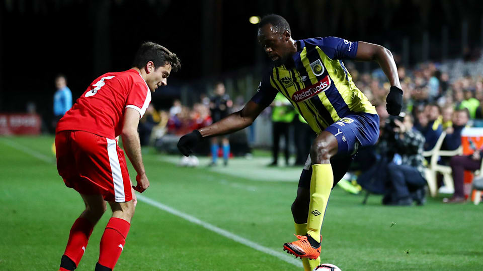 Bolt's football debut in pictures
