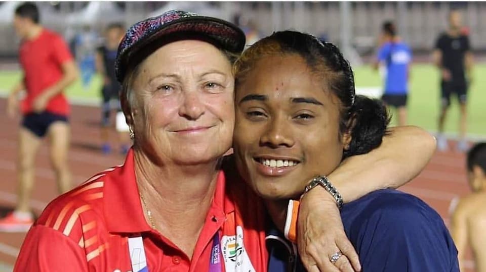 Who has coached Hima Das to sprinting success?