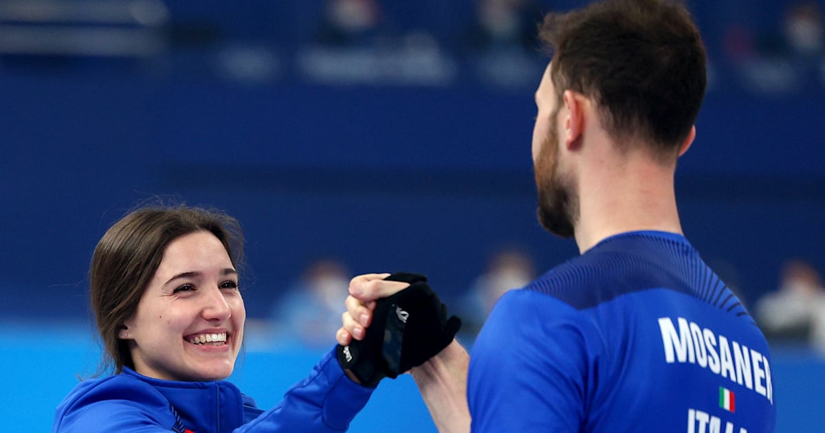 A warm reception for Stefania Constantini as she brings home curling gold